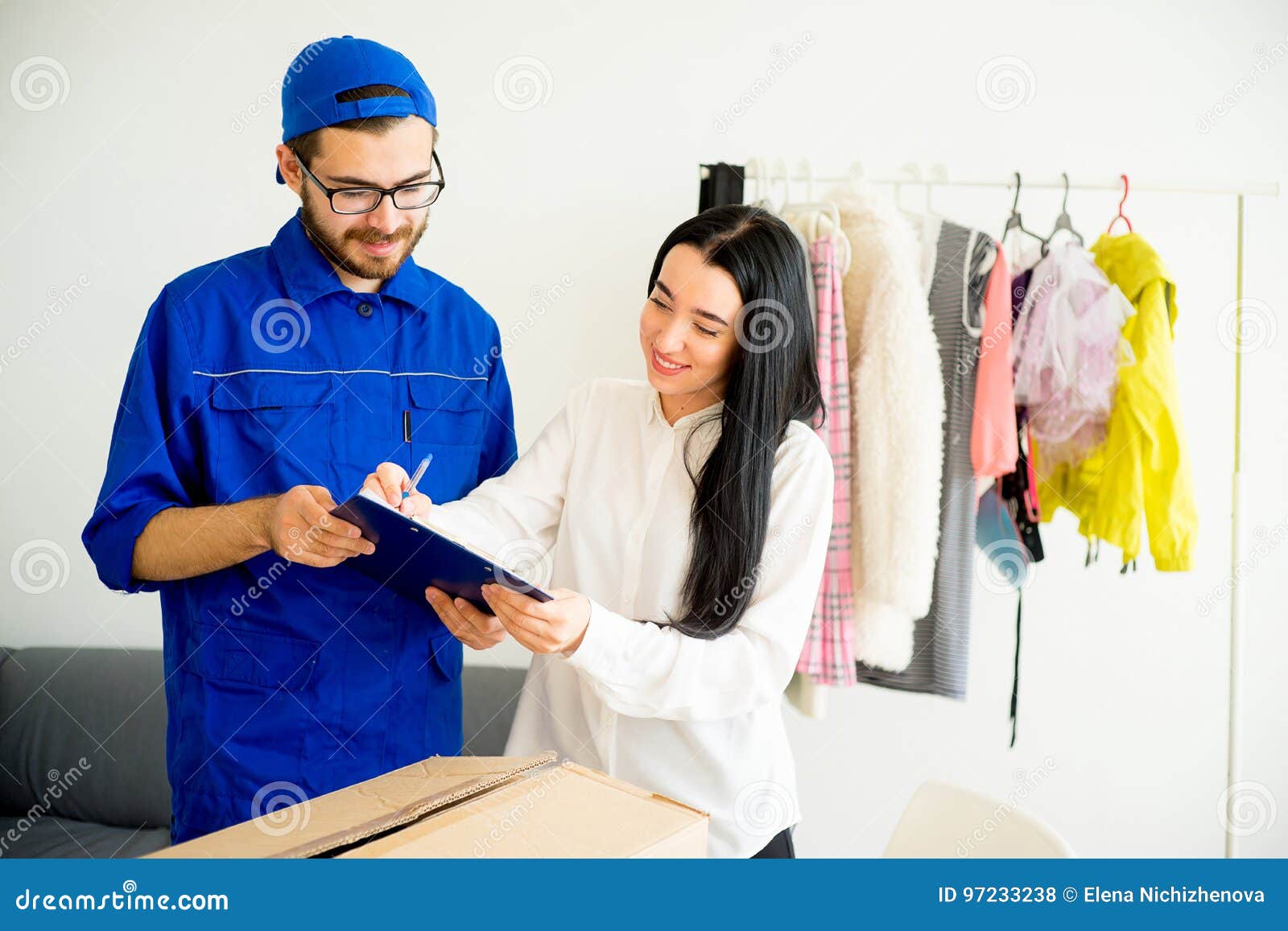 Woman accepting a delivery stock photo. Image of manual - 97233238
