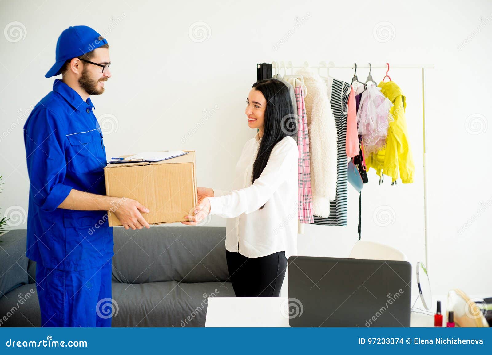 Woman accepting a delivery stock photo. Image of service - 97233374