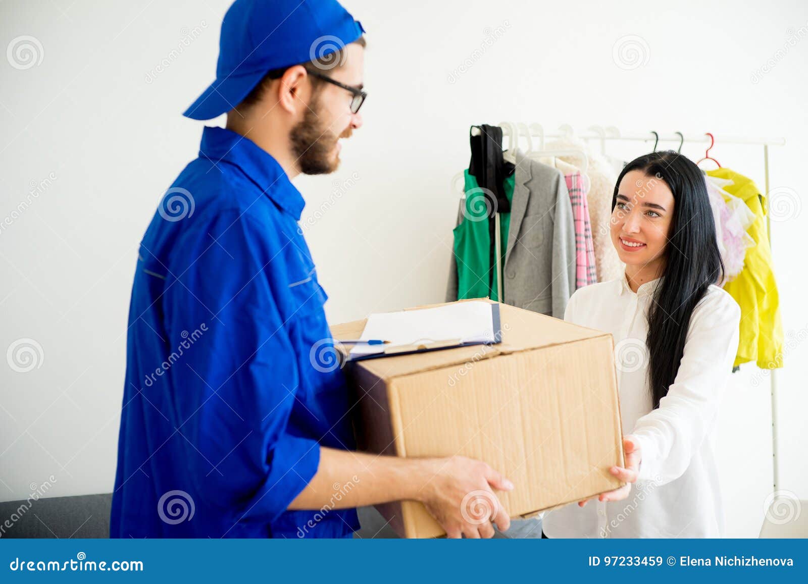 Woman accepting a delivery stock image. Image of carton - 97233459
