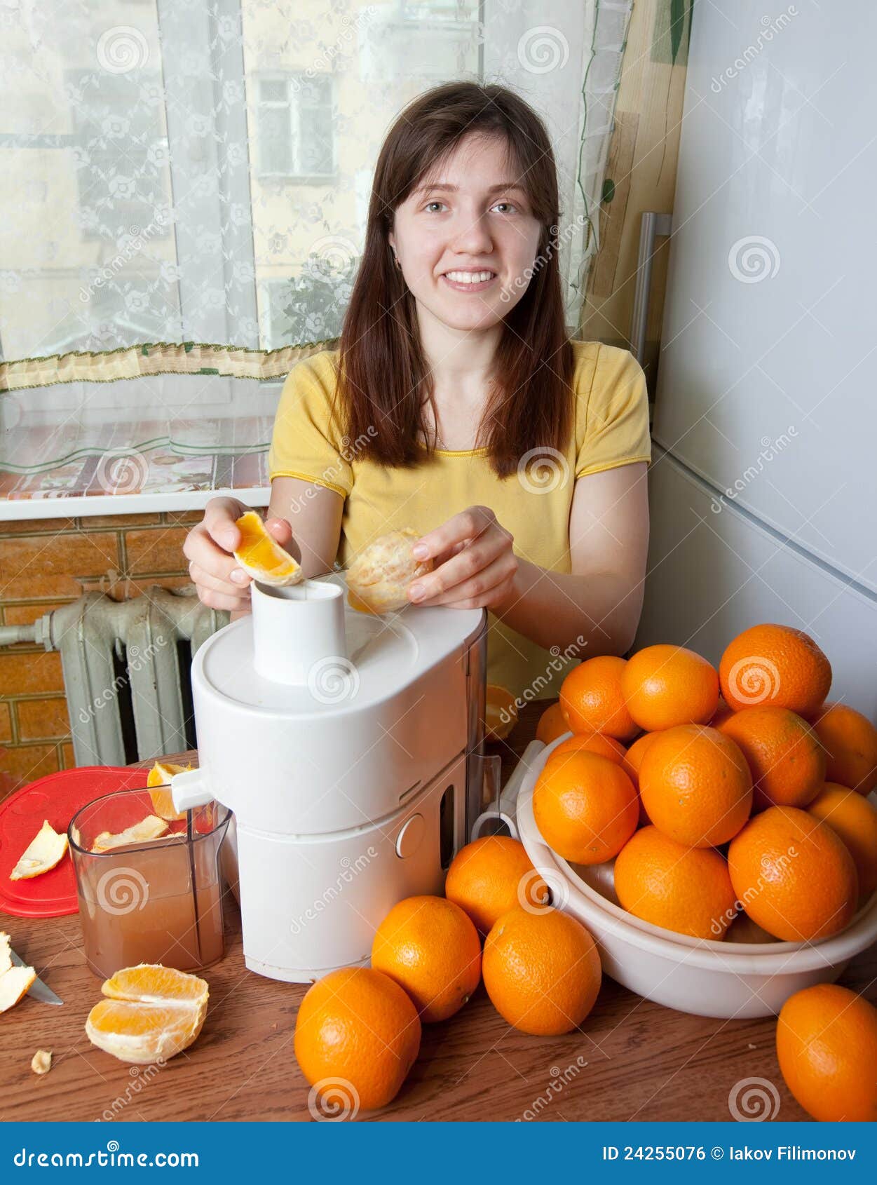 Woman Adding Orange To Juicer Stock Photo - Image of electricity, fruit ...
