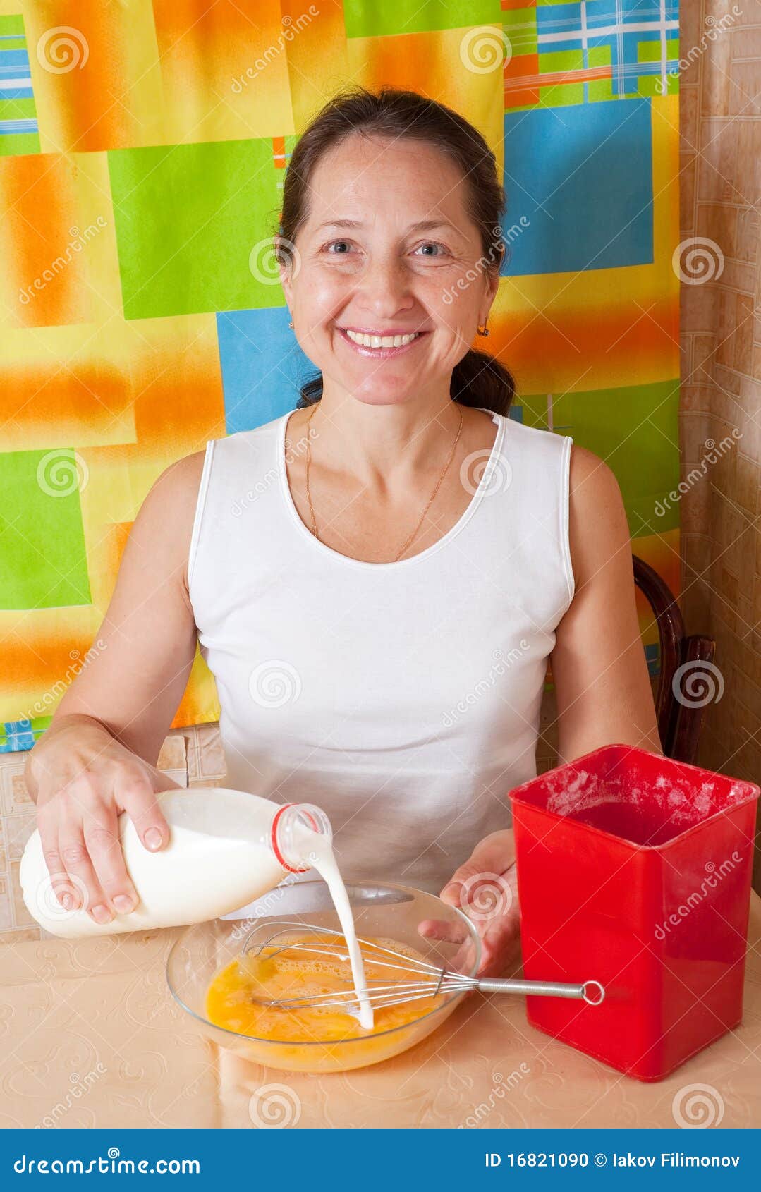 Woman adds milk into dish stock photo. Image of homework - 16821090