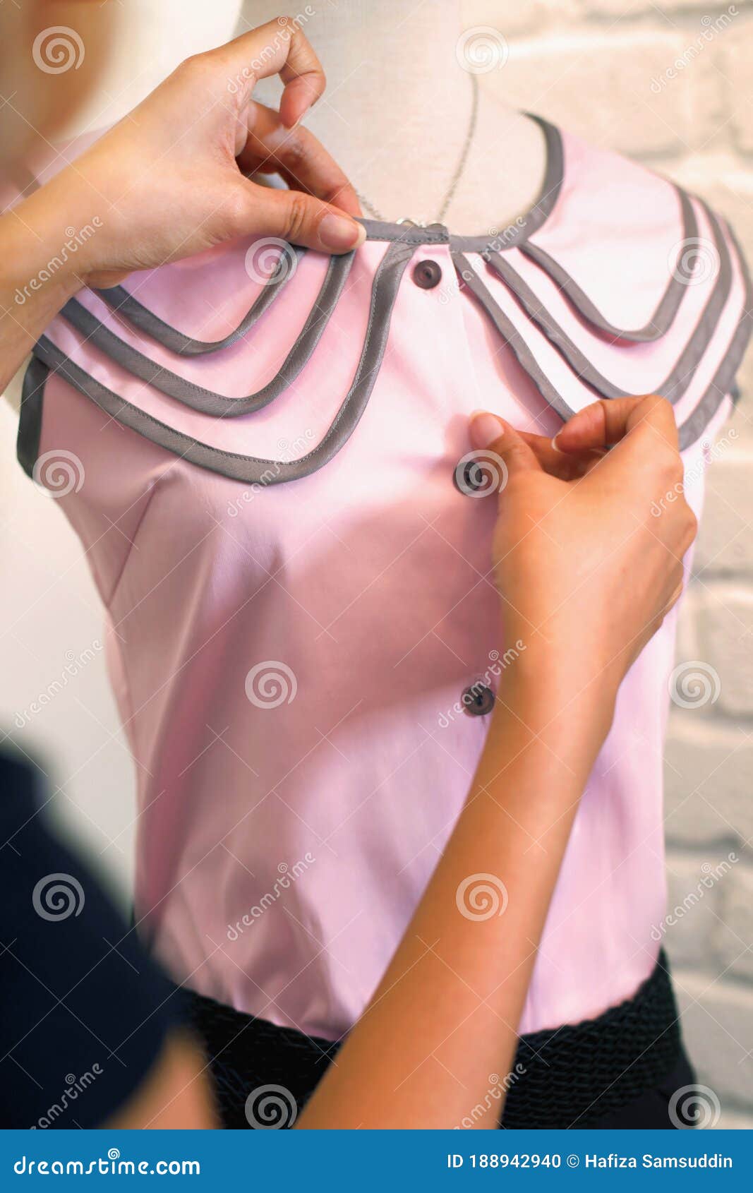 Woman Adjusting Clothes on Mannequin. Conceptual Image Stock Photo ...