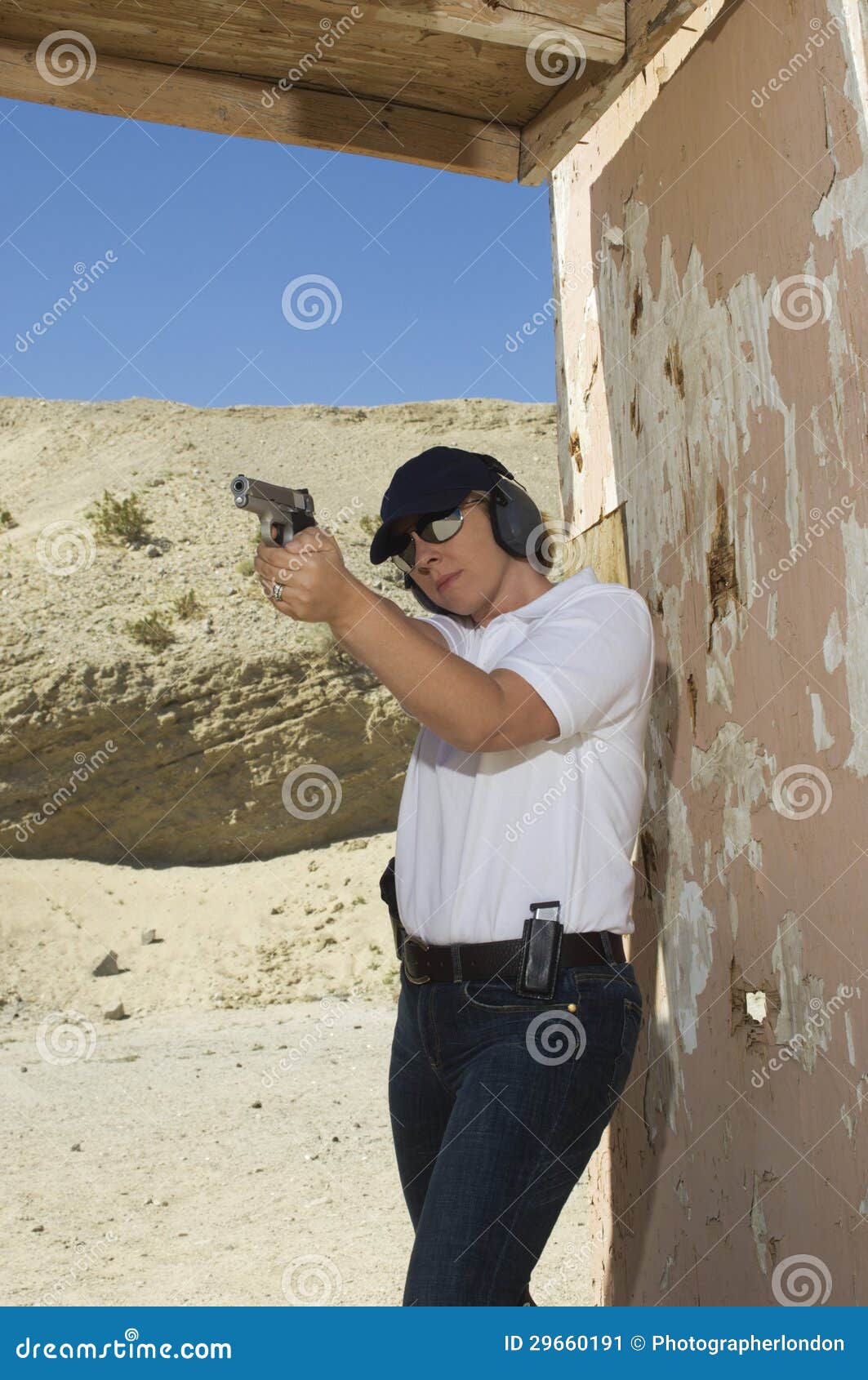 Woman Aiming Hand Gun at Firing Range Stock Image - Image of officer ...