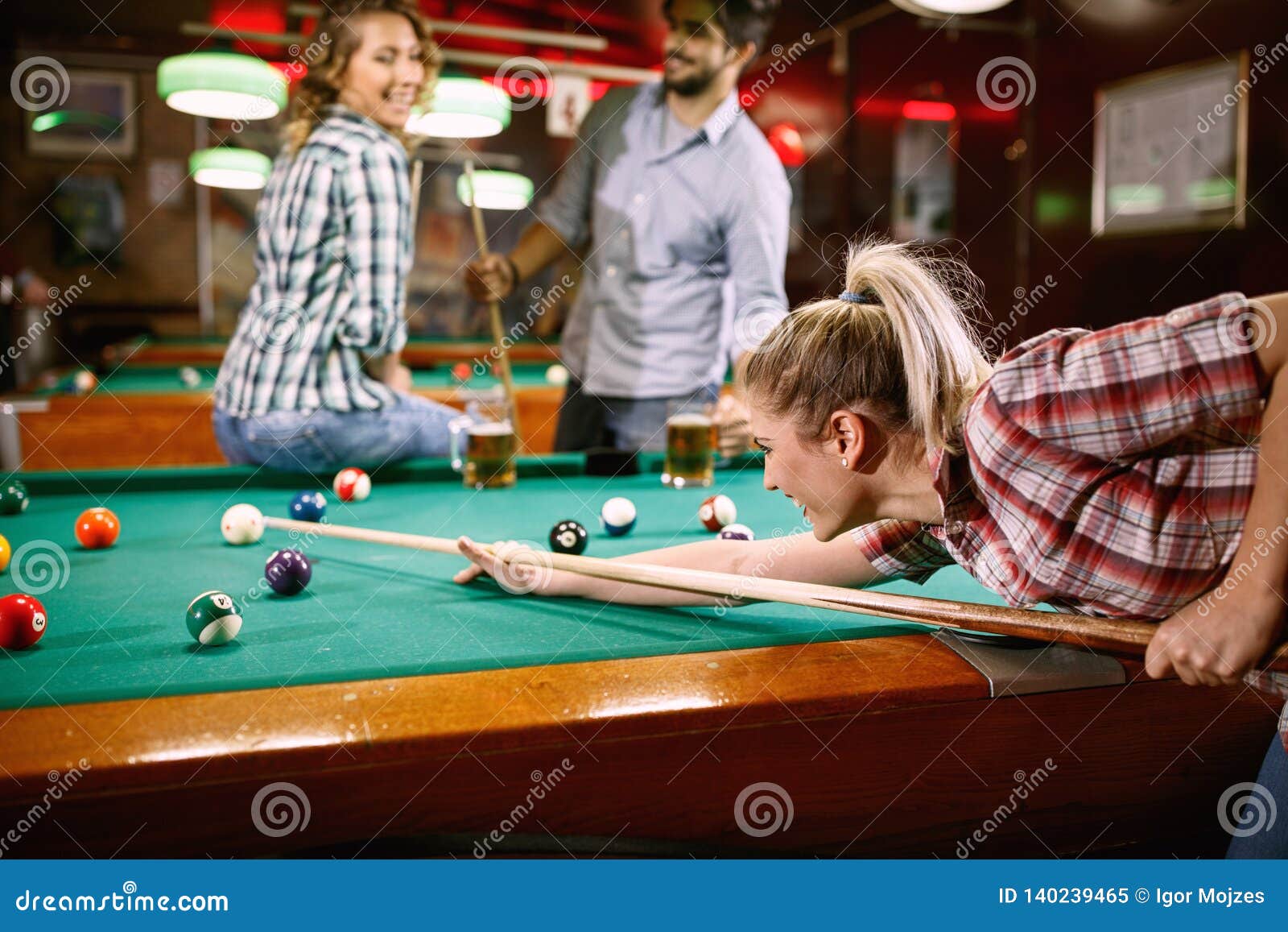 Woman Aiming on Pool Ball while Playing Billiard Stock Image - Image of ...
