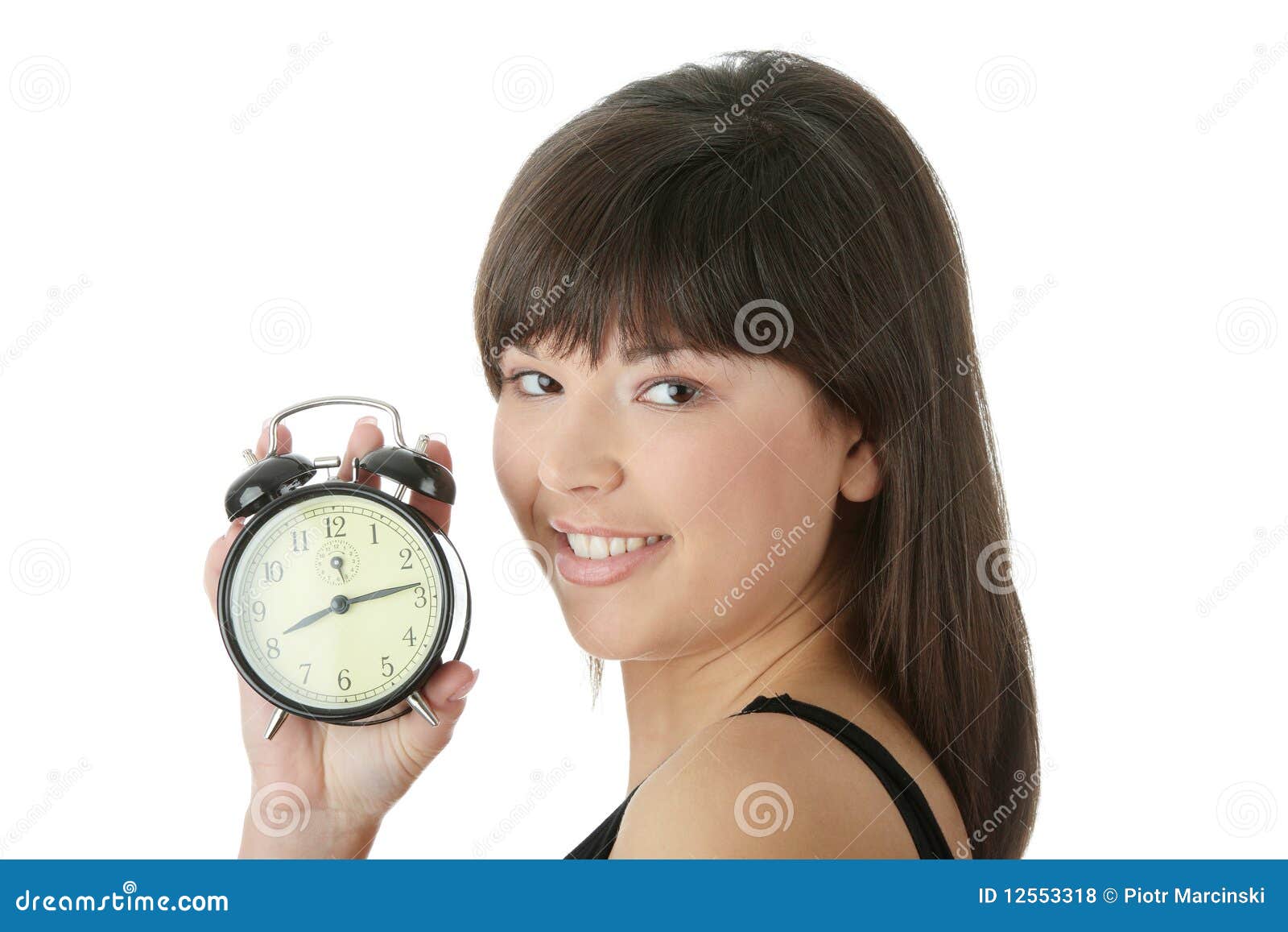 Woman with alarm clock stock photo. Image of face, looking - 12553318