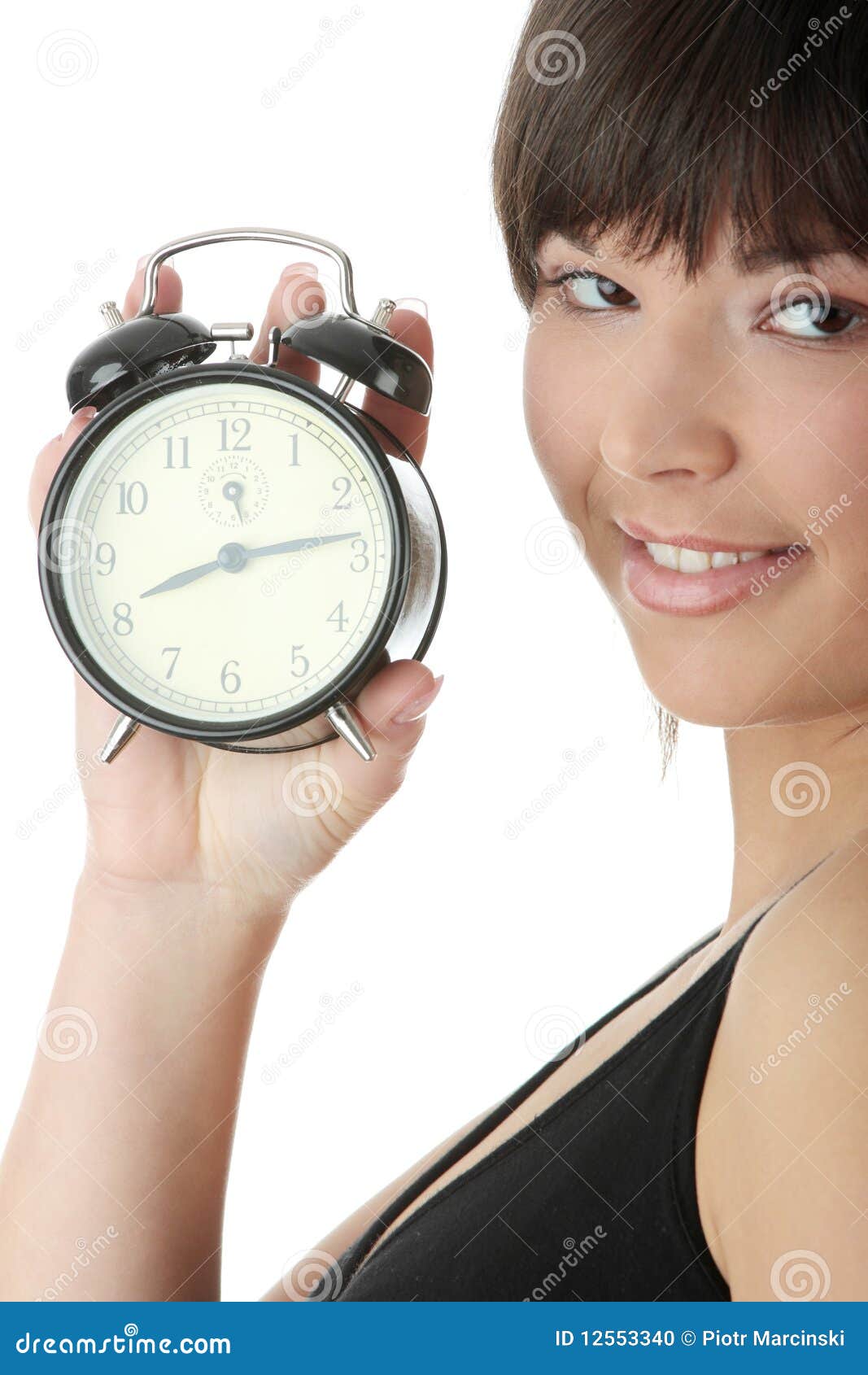 Woman with alarm clock stock photo. Image of portrait - 12553340