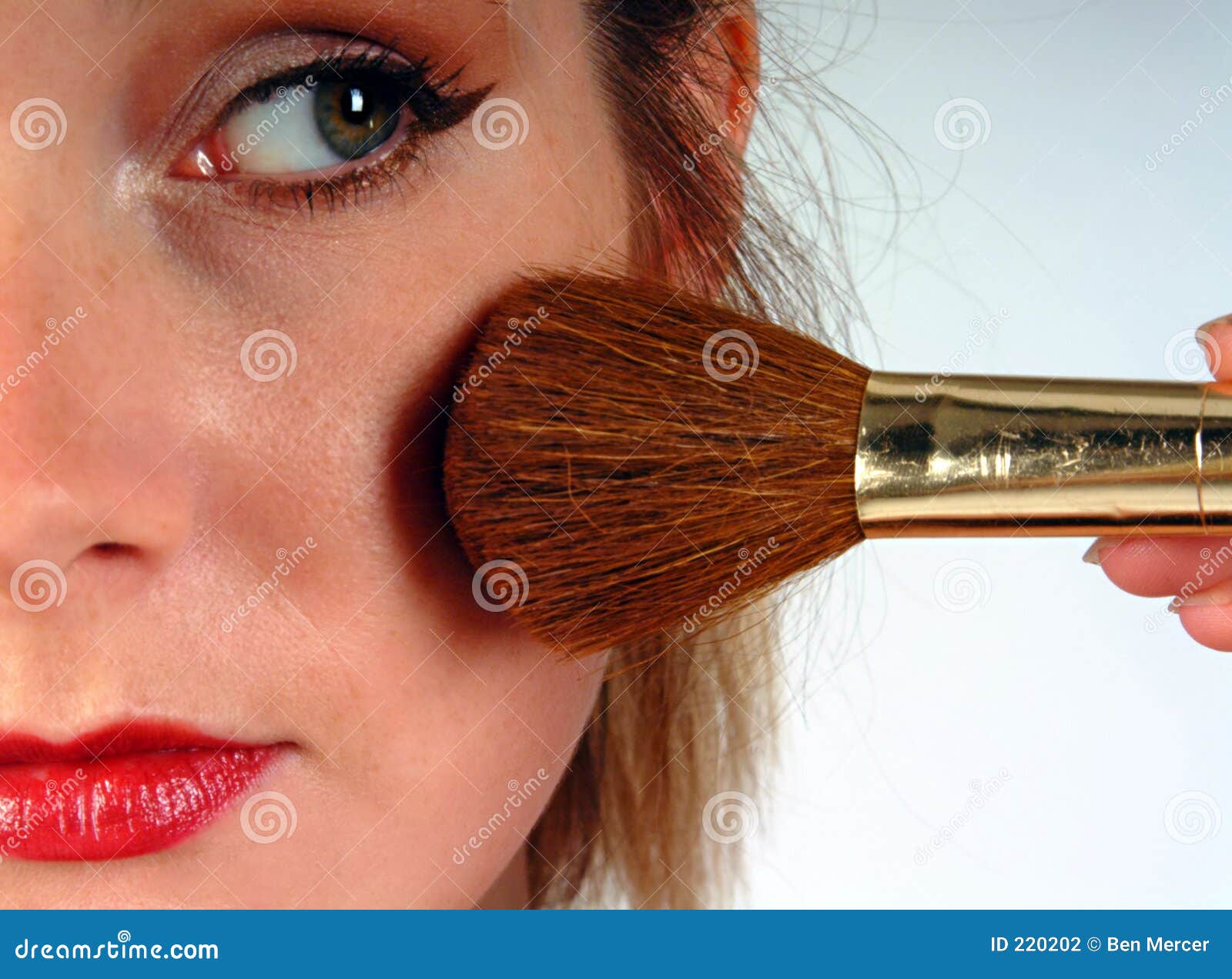 Woman applying blusher stock photo. Image of expression - 220202