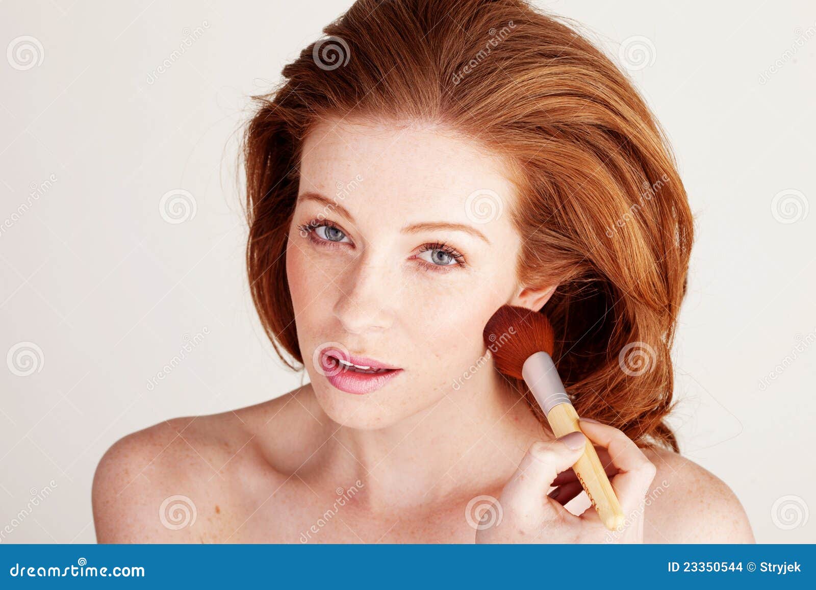 Woman Applying Blusher To Her Cheek Stock Photo - Image of beauty ...