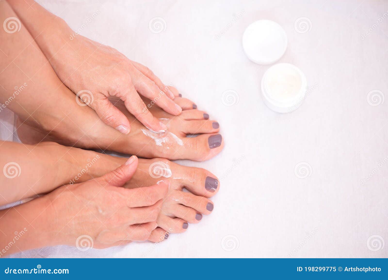 Woman Applying Body Lotion On Her Feet Stock Image Image Of Cosmetic Container 198299775