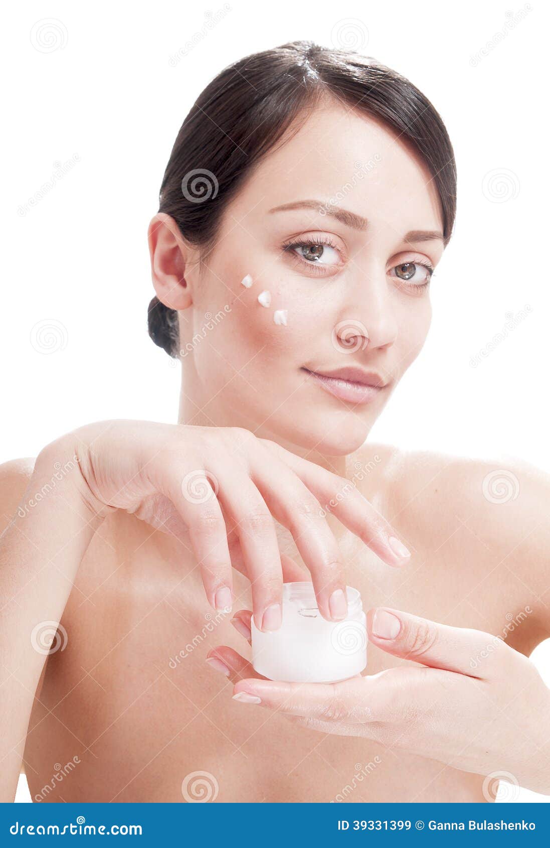 Woman Applying Cosmetic Cream Treatment On Her Face Stock Image