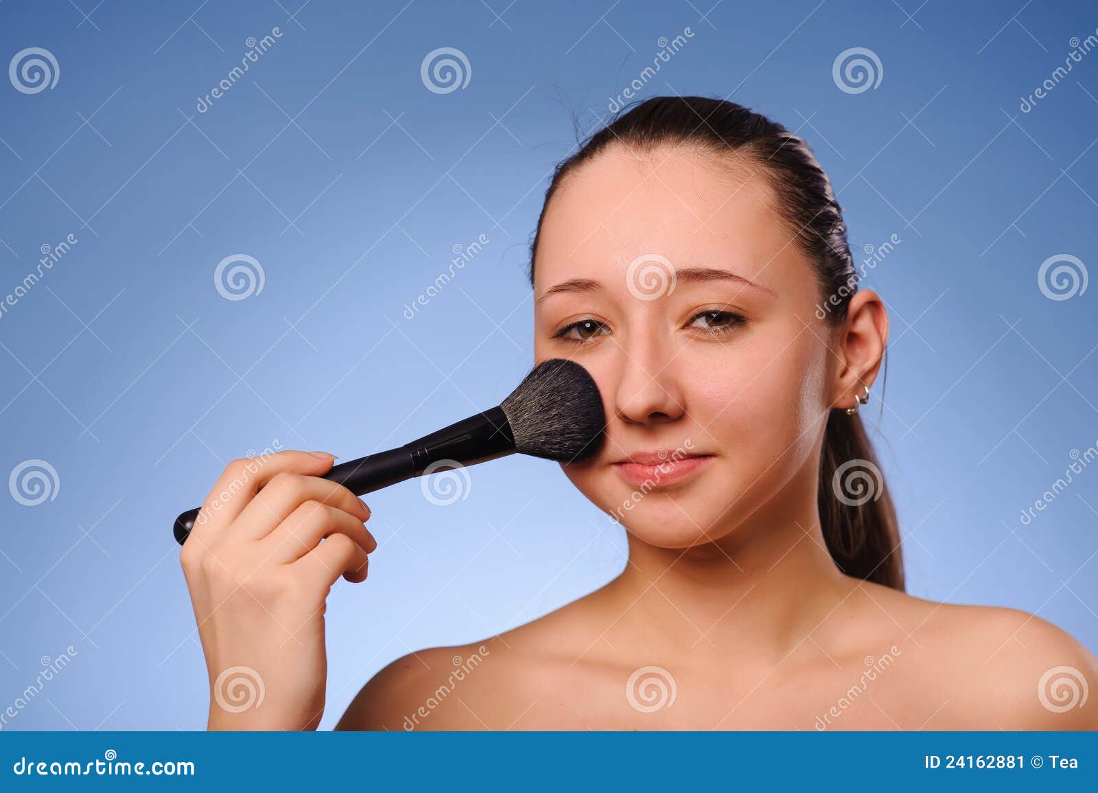 Woman applying cosmetics stock image. Image of beauty - 24162881
