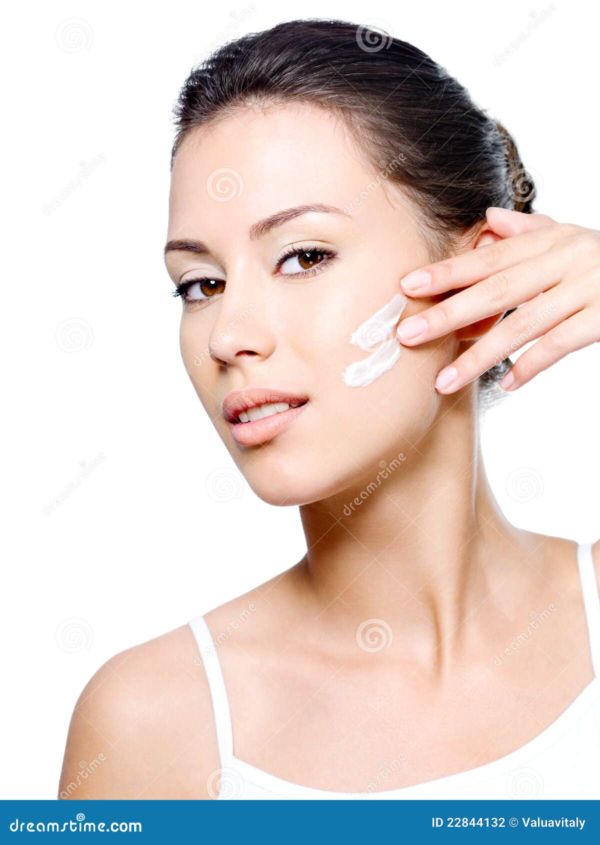 Woman Applying Cream On Her Face Stock Photography - Image: 22844132