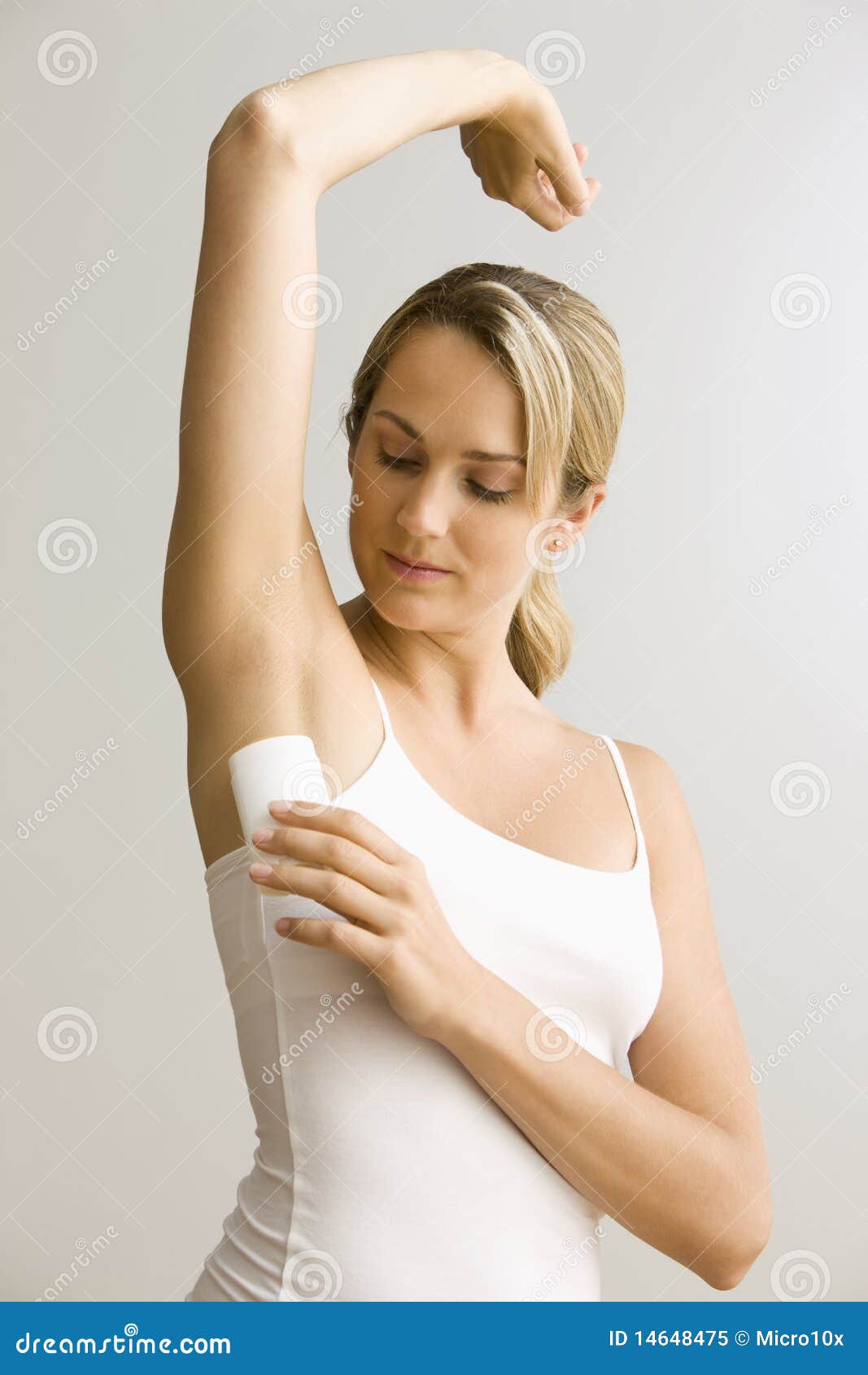 Woman Applying Deodorant stock image. Image of people - 14648475