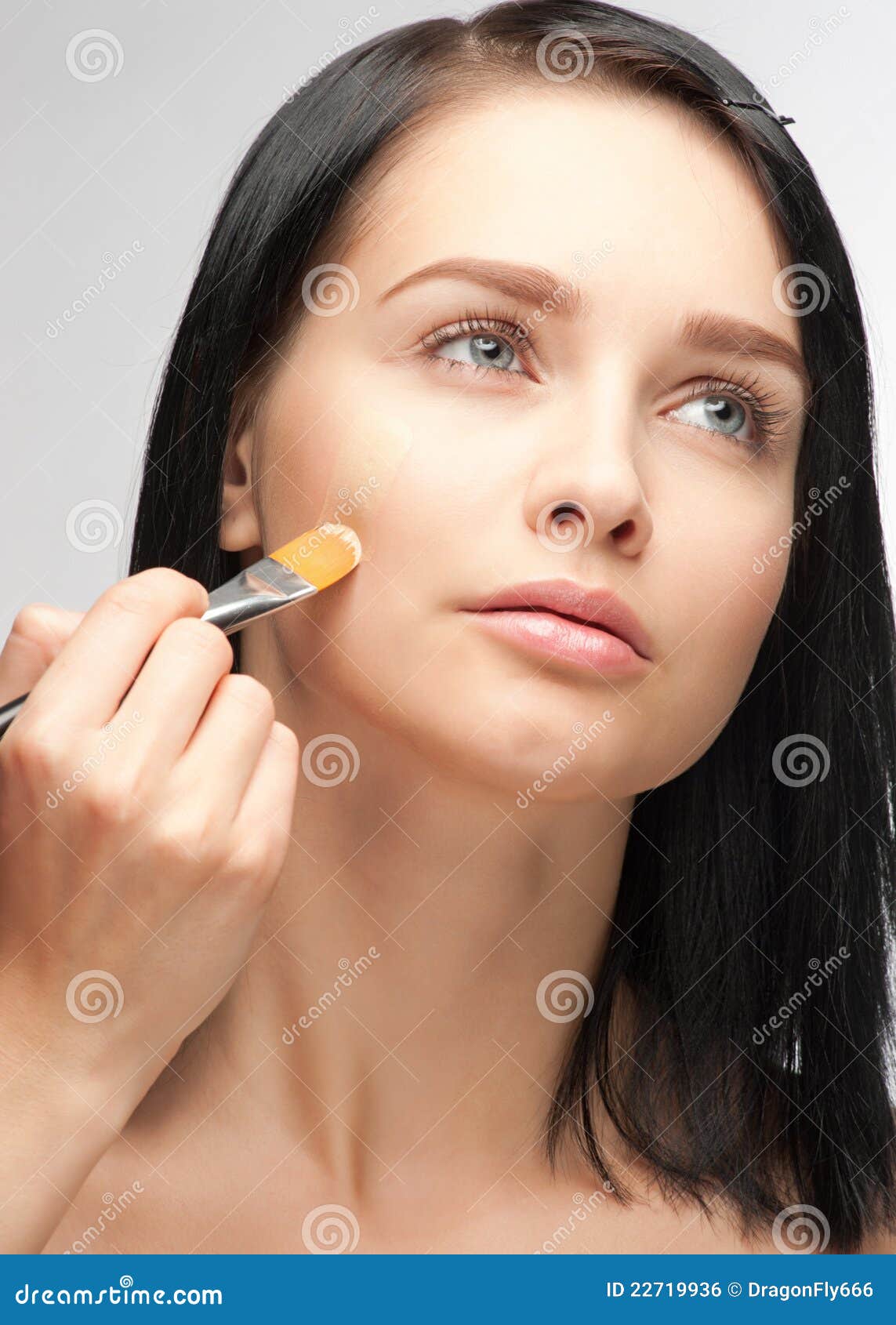 Woman applying foundation stock photo. Image of fashion - 22719936