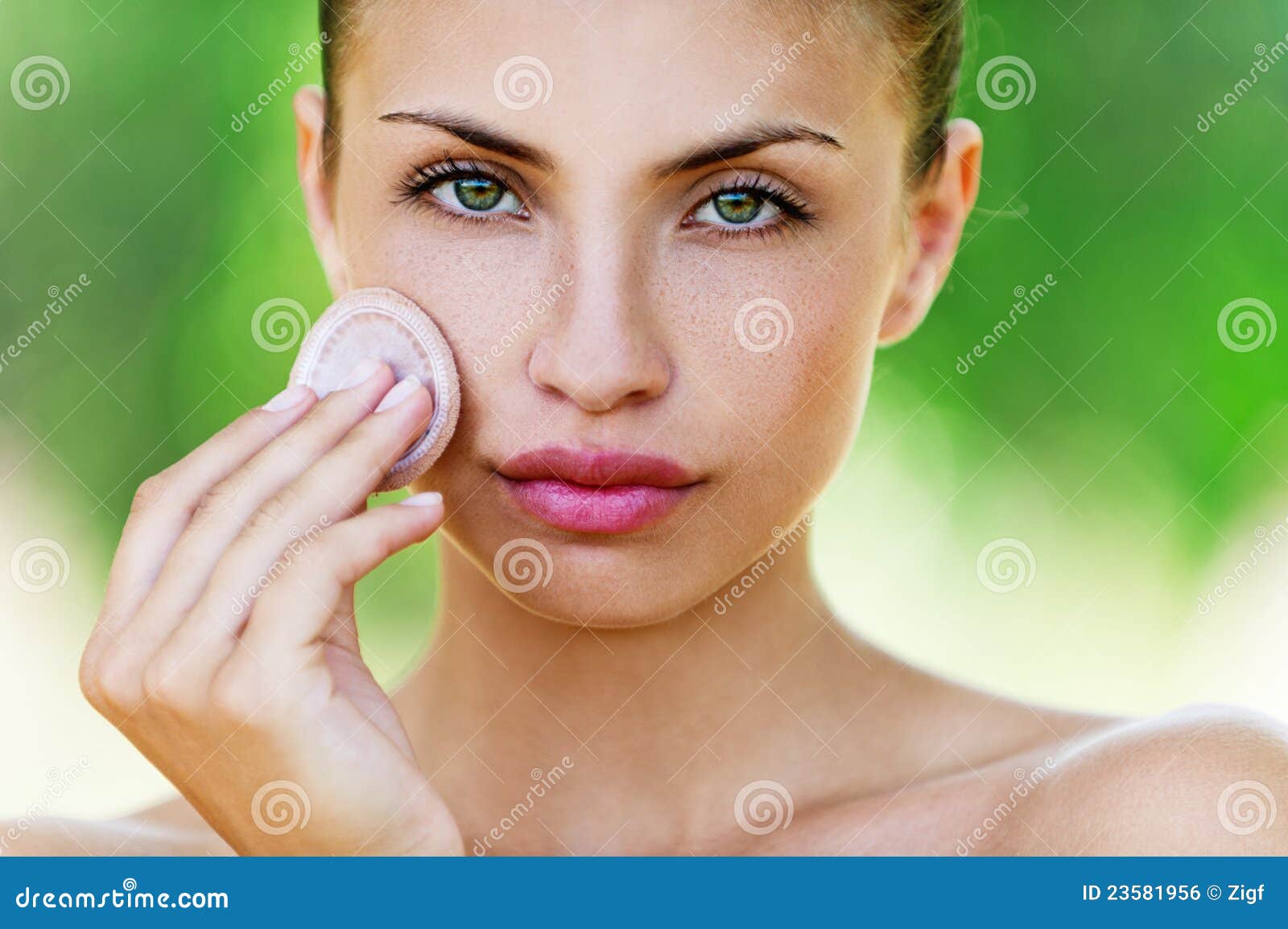 Woman applying foundation stock photo. Image of cosmetic - 23581956