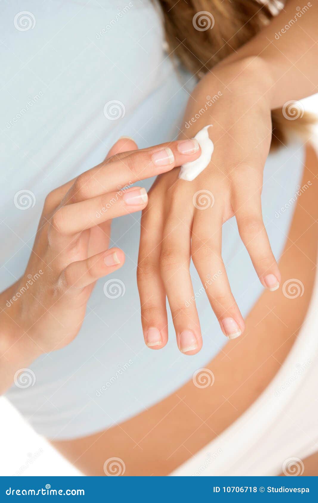 Woman applying hand cream stock photo. Image of light - 10706718