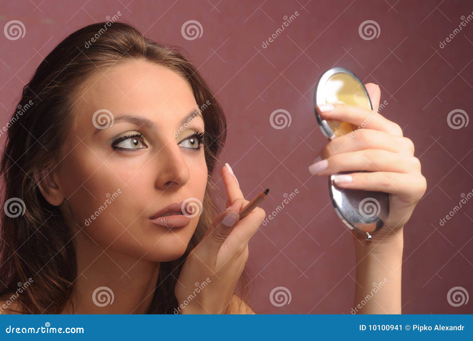 Woman applying her make-up stock image. Image of mirror - 10100941