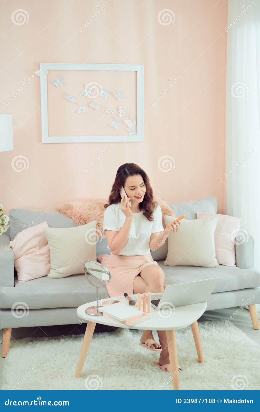 Woman Applying Her Makeup Decorative Cosmetics and Talking on Phone ...