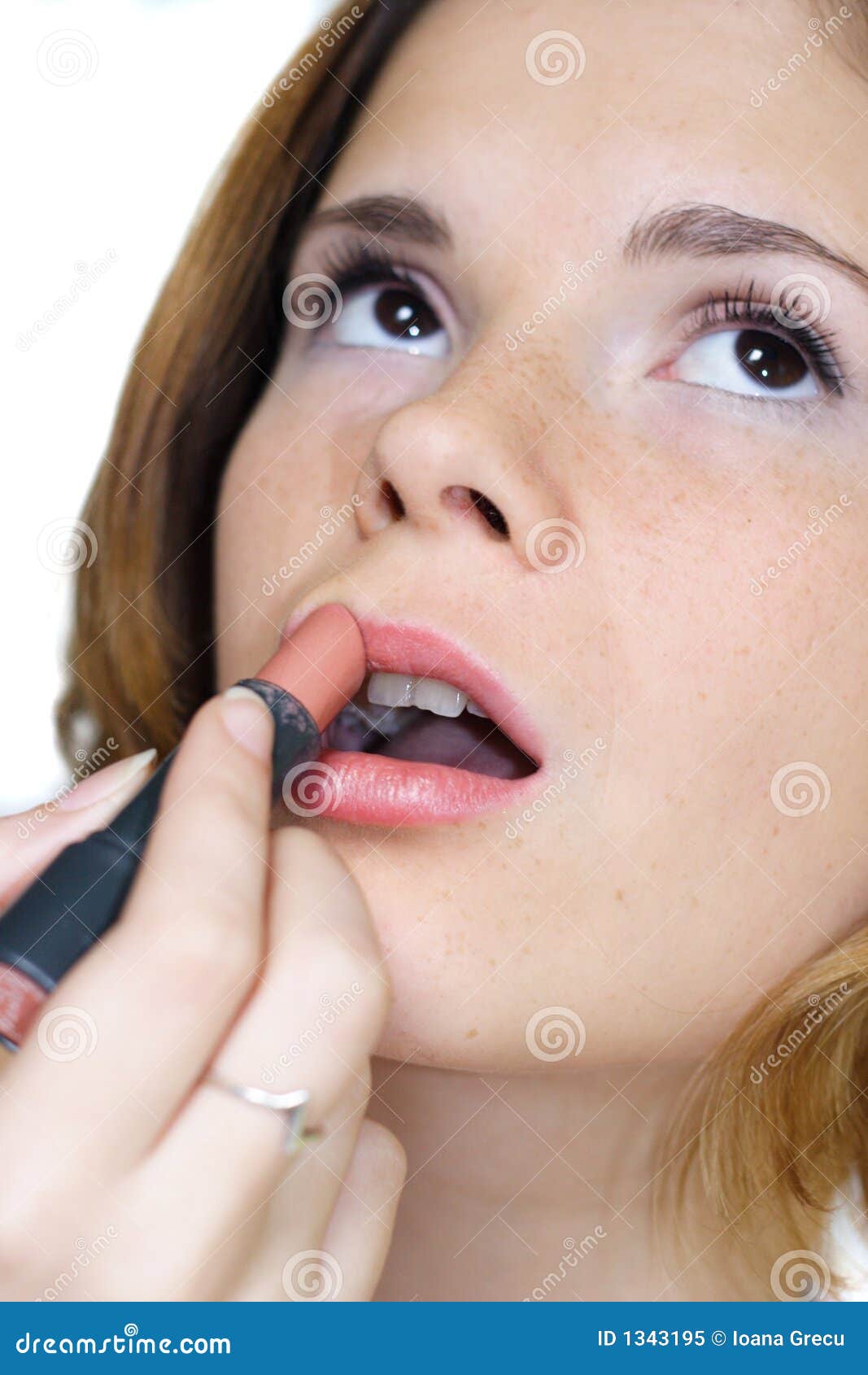 Woman applying lipstick stock image. Image of beige, powder - 1343195