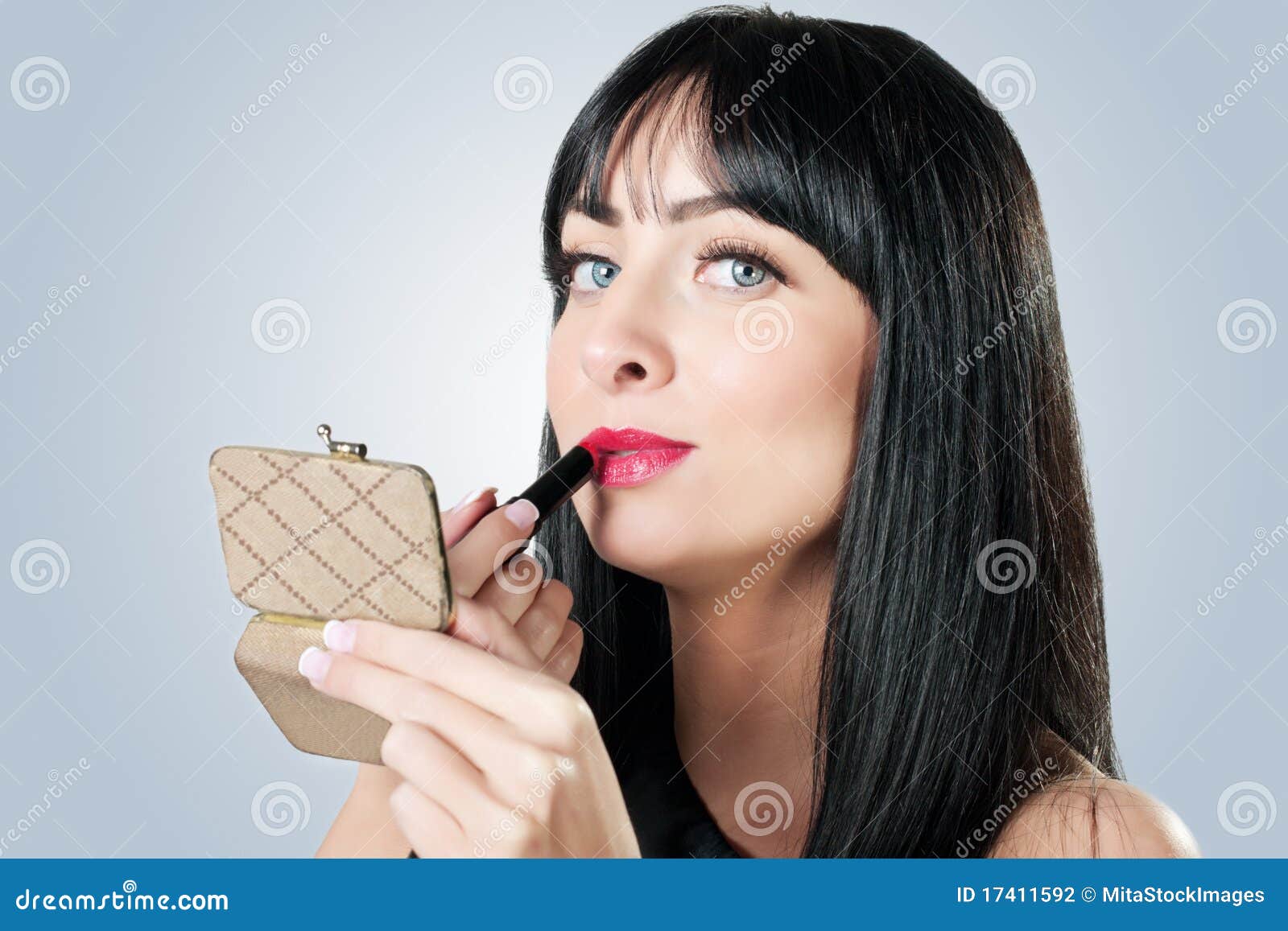 Woman applying lipstick stock photo. Image of color, makeup - 17411592