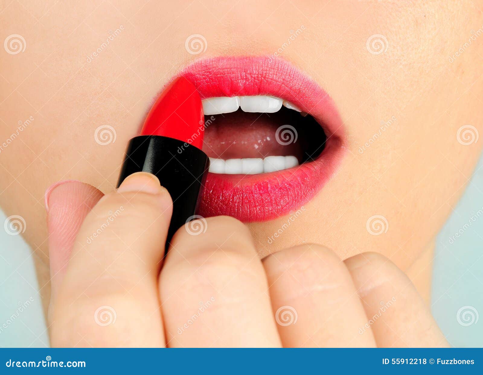 Woman applying lipstick stock photo. Image of health - 55912218
