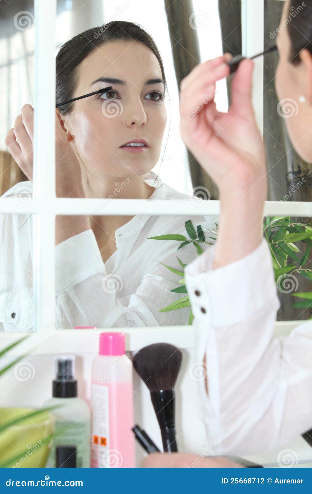 Woman applying make-up stock photo. Image of lipstick - 25668712
