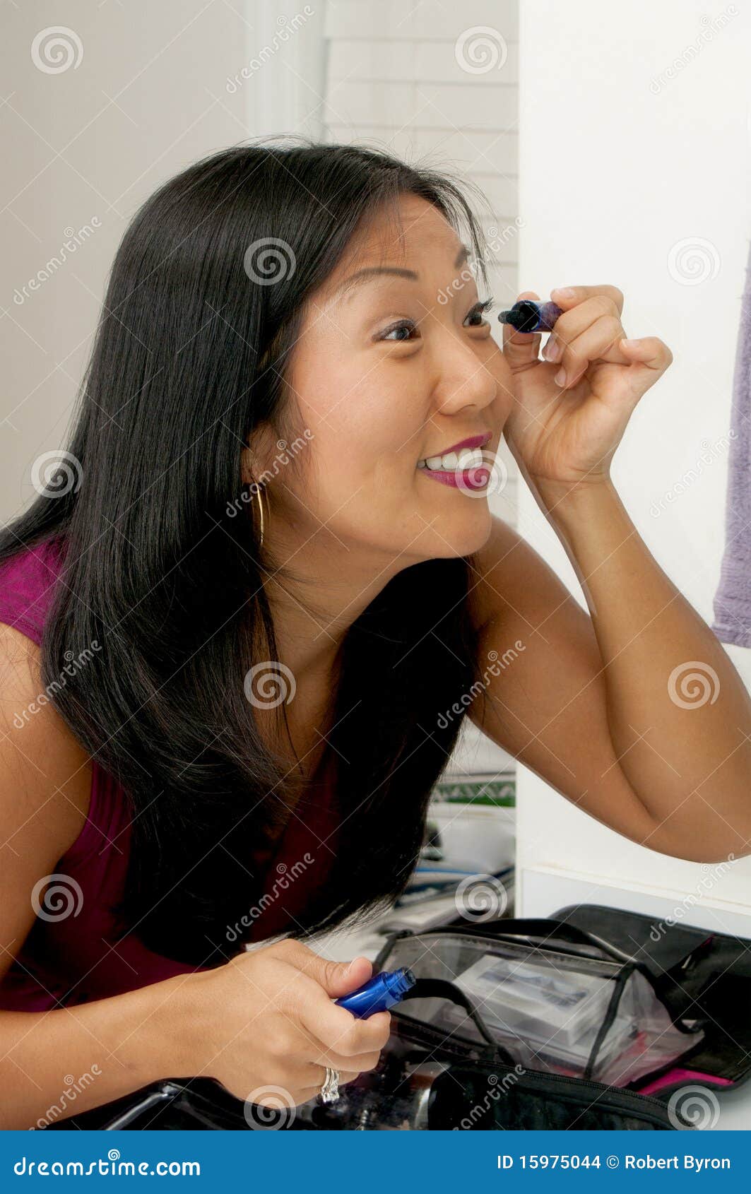 Woman Applying Makeup stock photo. Image of female, elegance - 15975044