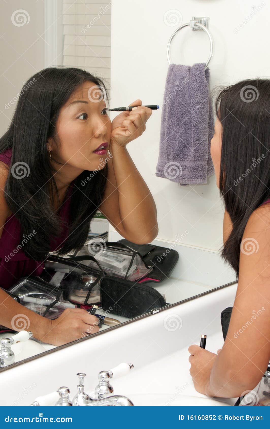 Woman Applying Makeup stock photo. Image of face, cosmetic - 16160852
