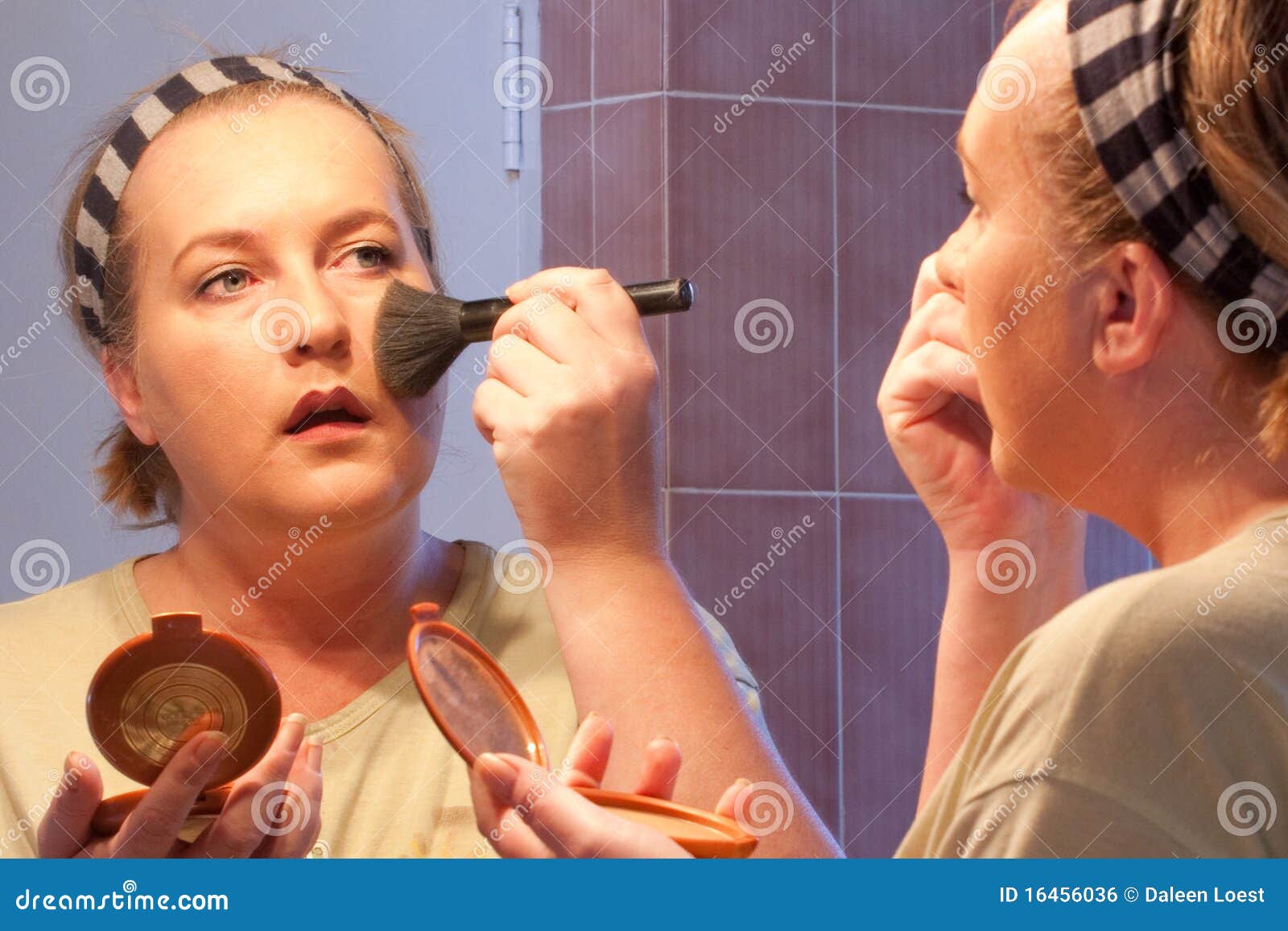 Woman applying makeup stock photo. Image of action, adult - 16456036
