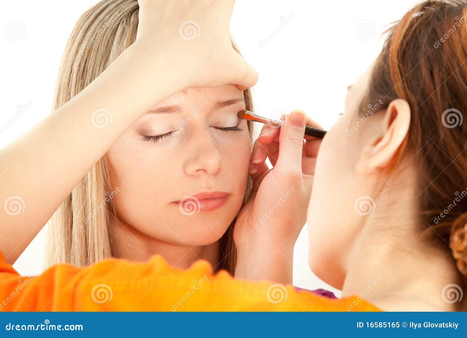 Woman applying makeup stock image. Image of girls, facial - 16585165