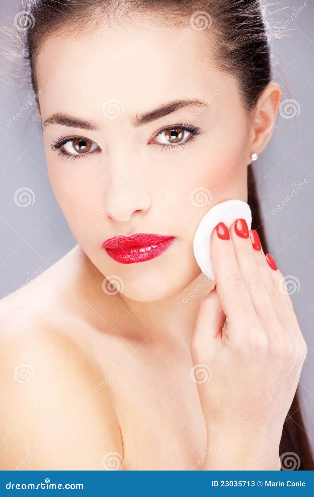 Woman applying makeup stock image. Image of cosmetics - 23035713