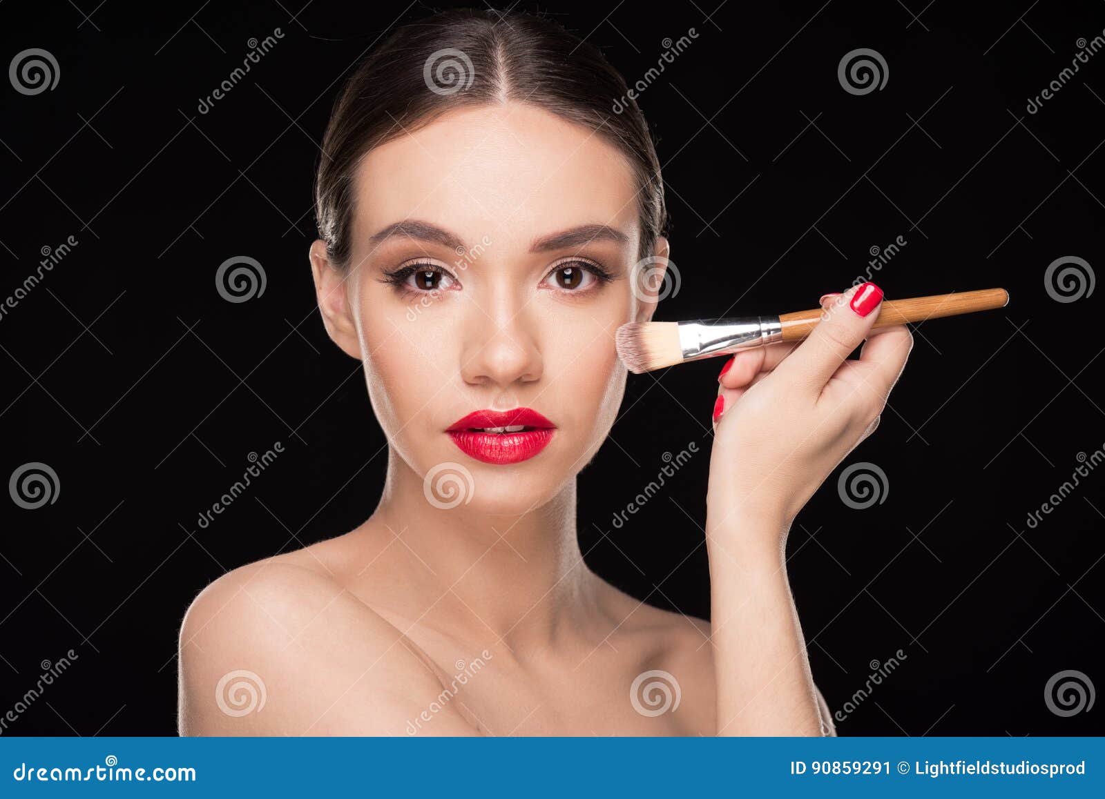 Woman applying makeup stock image. Image of stylish, brunette - 90859291