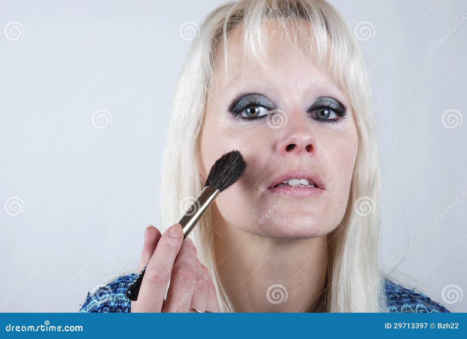 Woman applying makeup stock image. Image of beauty, applying - 29713397