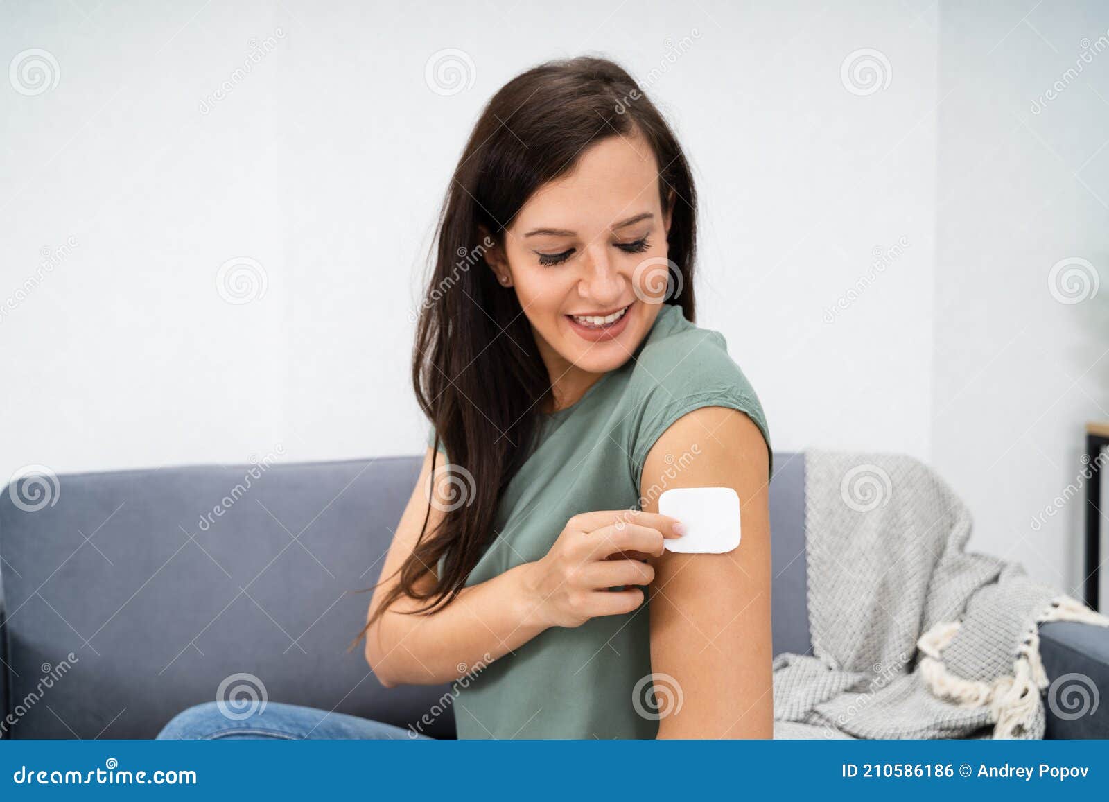 Woman Applying Patch on Her Arm Stock Photo - Image of applying, person ...