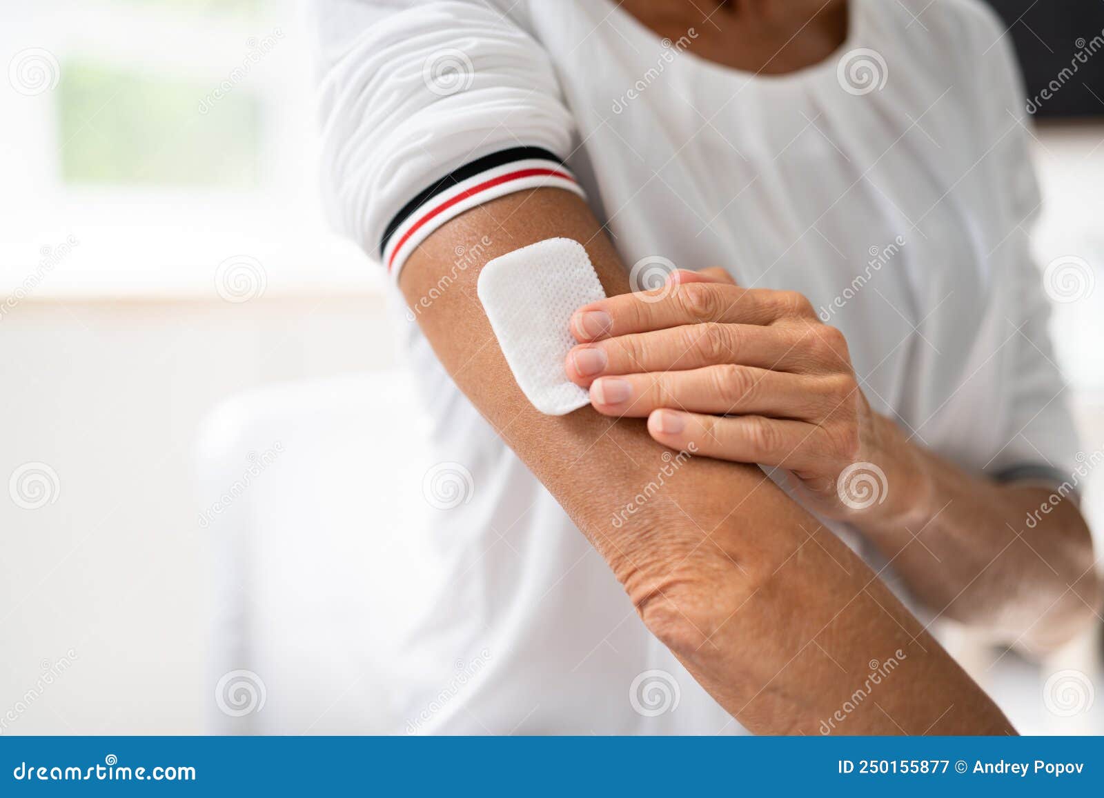 Woman Applying Patch on Her Arm Stock Image - Image of birth, smoke ...