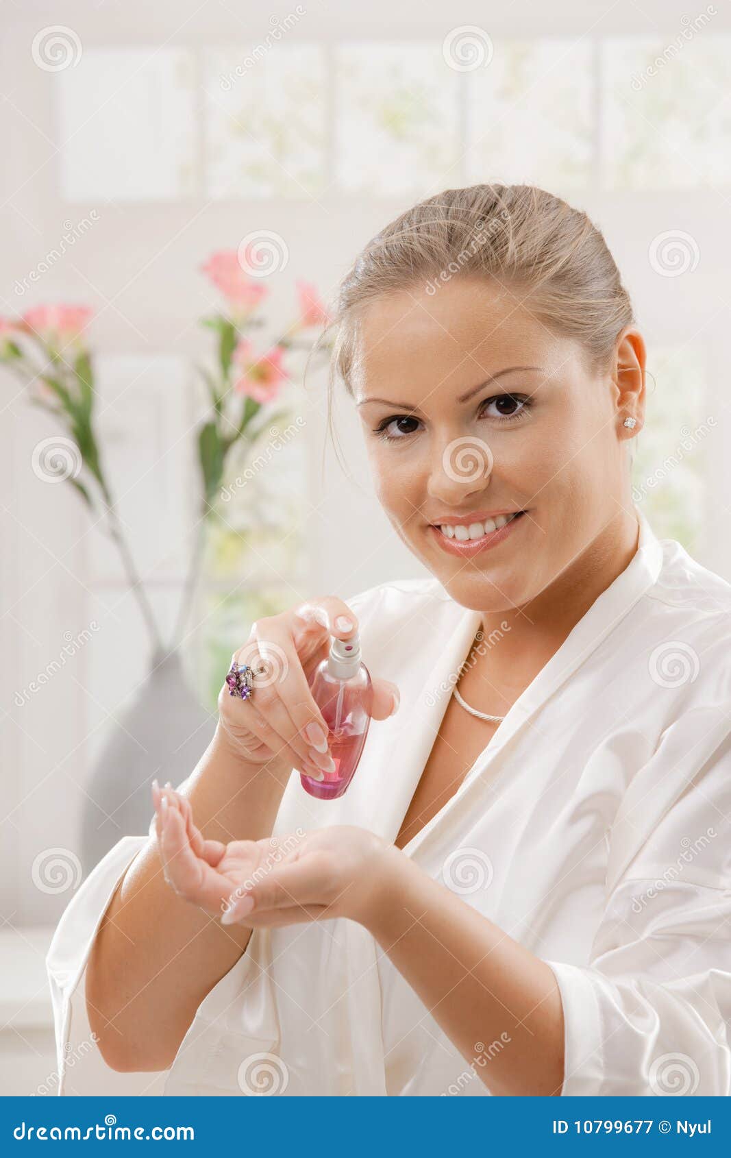 Woman applying perfume stock image. Image of bath, bottle - 10799677