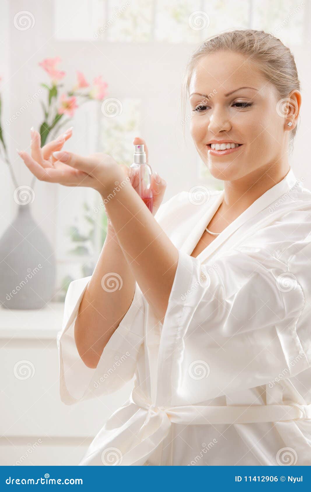 Woman applying perfume stock photo. Image of bottle, color - 11412906