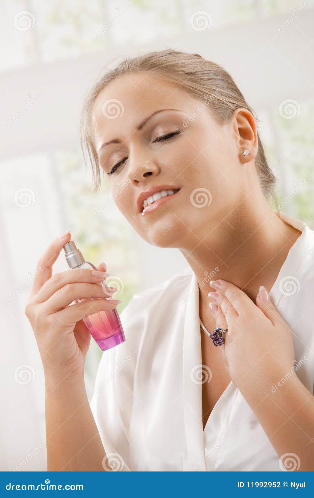Woman applying perfume stock photo. Image of feminine - 11992952