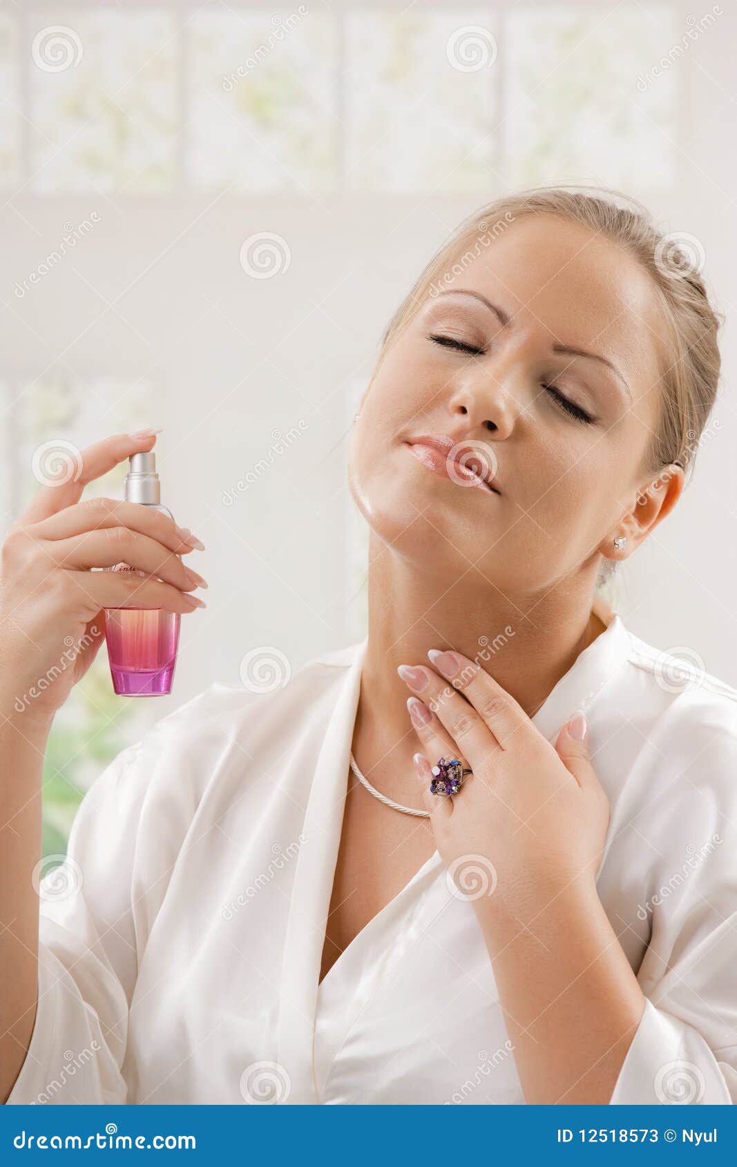 Woman applying perfume stock image. Image of clean, essence - 12518573