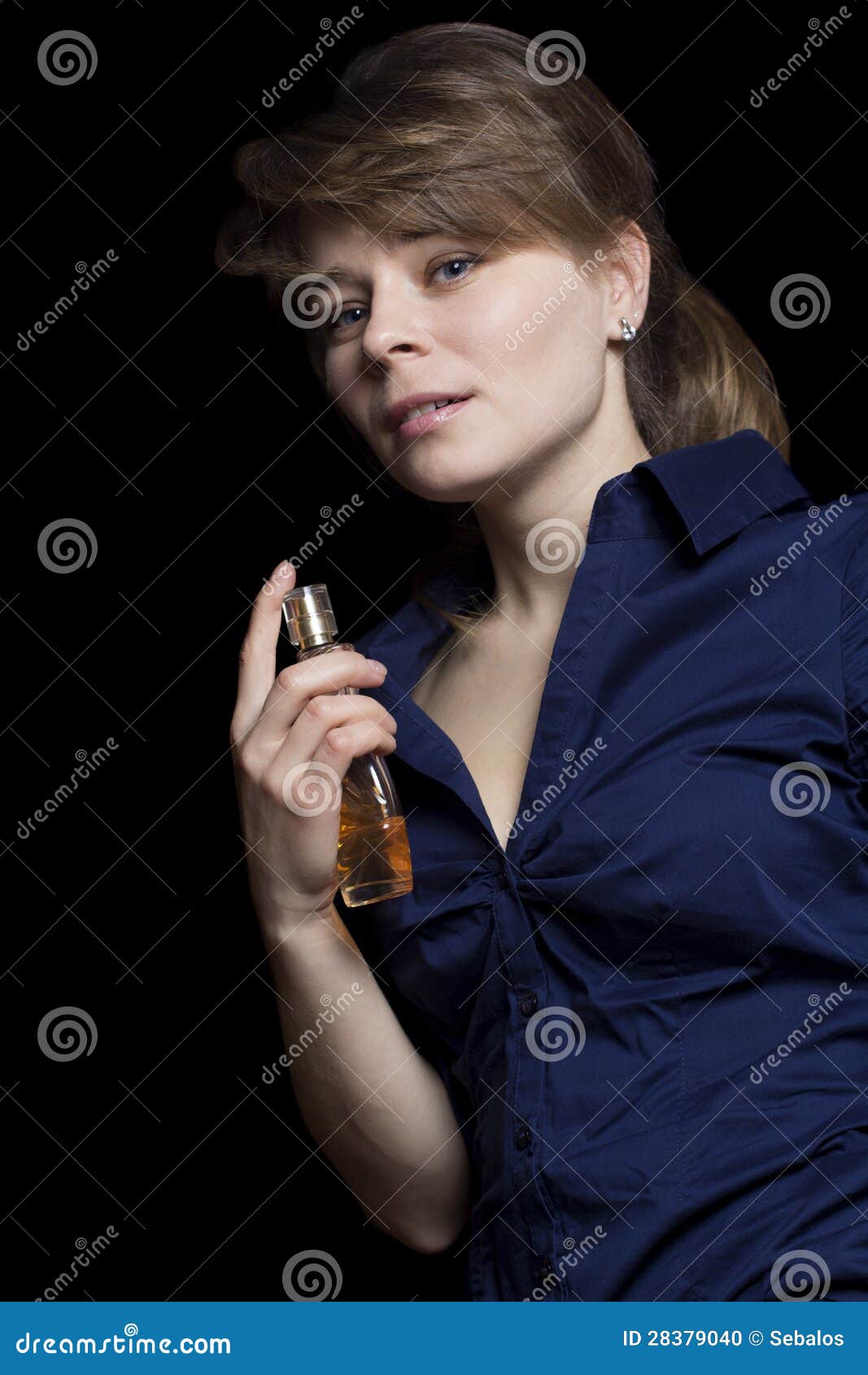 Woman applying perfume stock photo. Image of perfume - 28379040