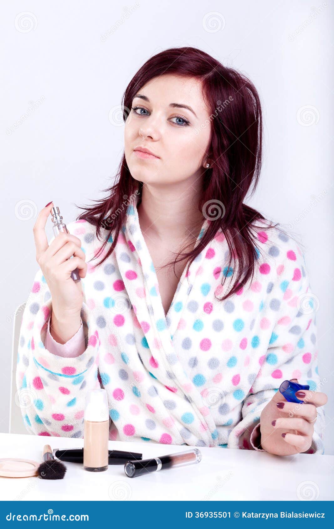 Woman applying perfume stock image. Image of bathrobe - 36935501