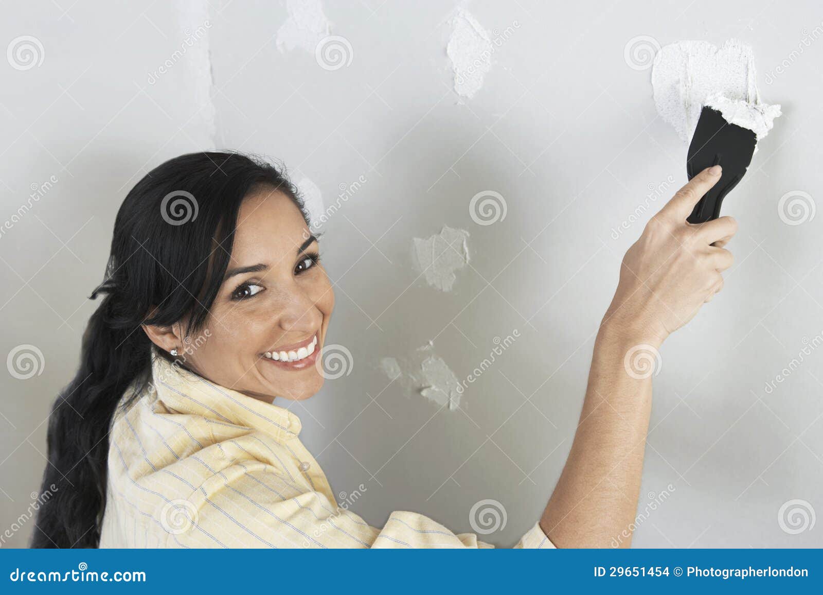 Woman Applying Putty on Wall Stock Photo - Image of aged, horizontal ...