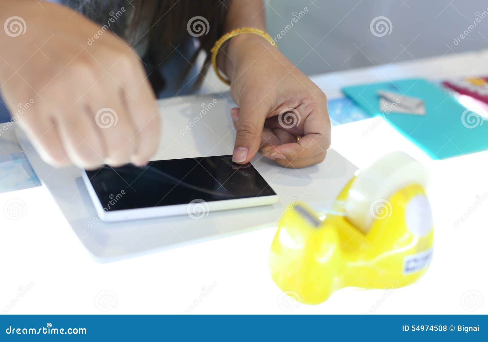 Woman Applying a Screen Protector on an Cellphone Stock Photo - Image ...