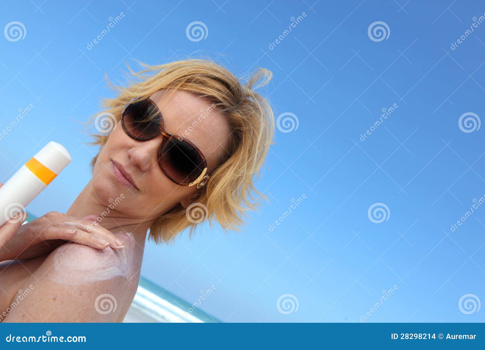 Woman applying sun cream stock photo. Image of warm, filter - 28298214
