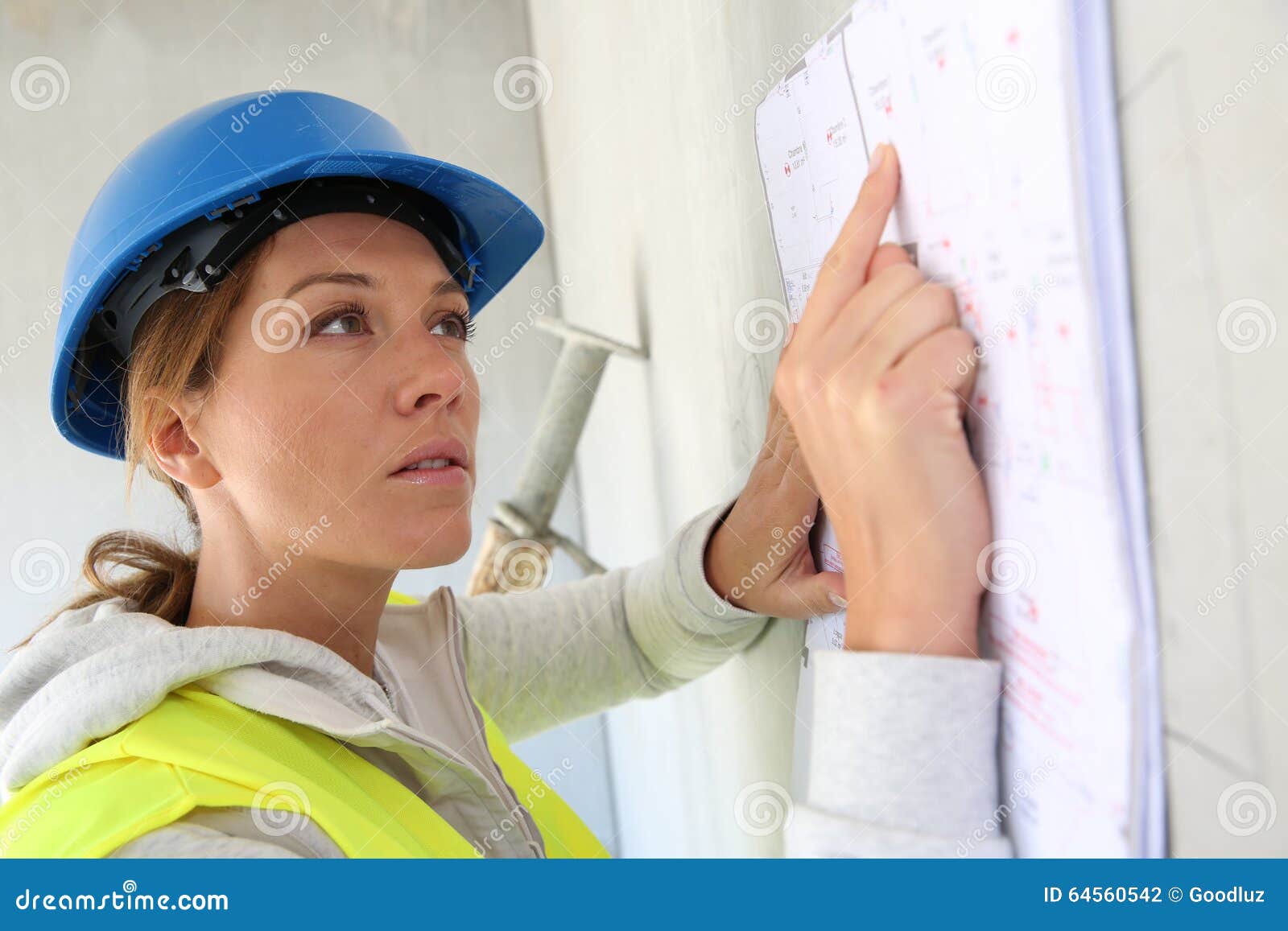 Woman Architect Reading Plan on Construction Site Stock Photo - Image ...
