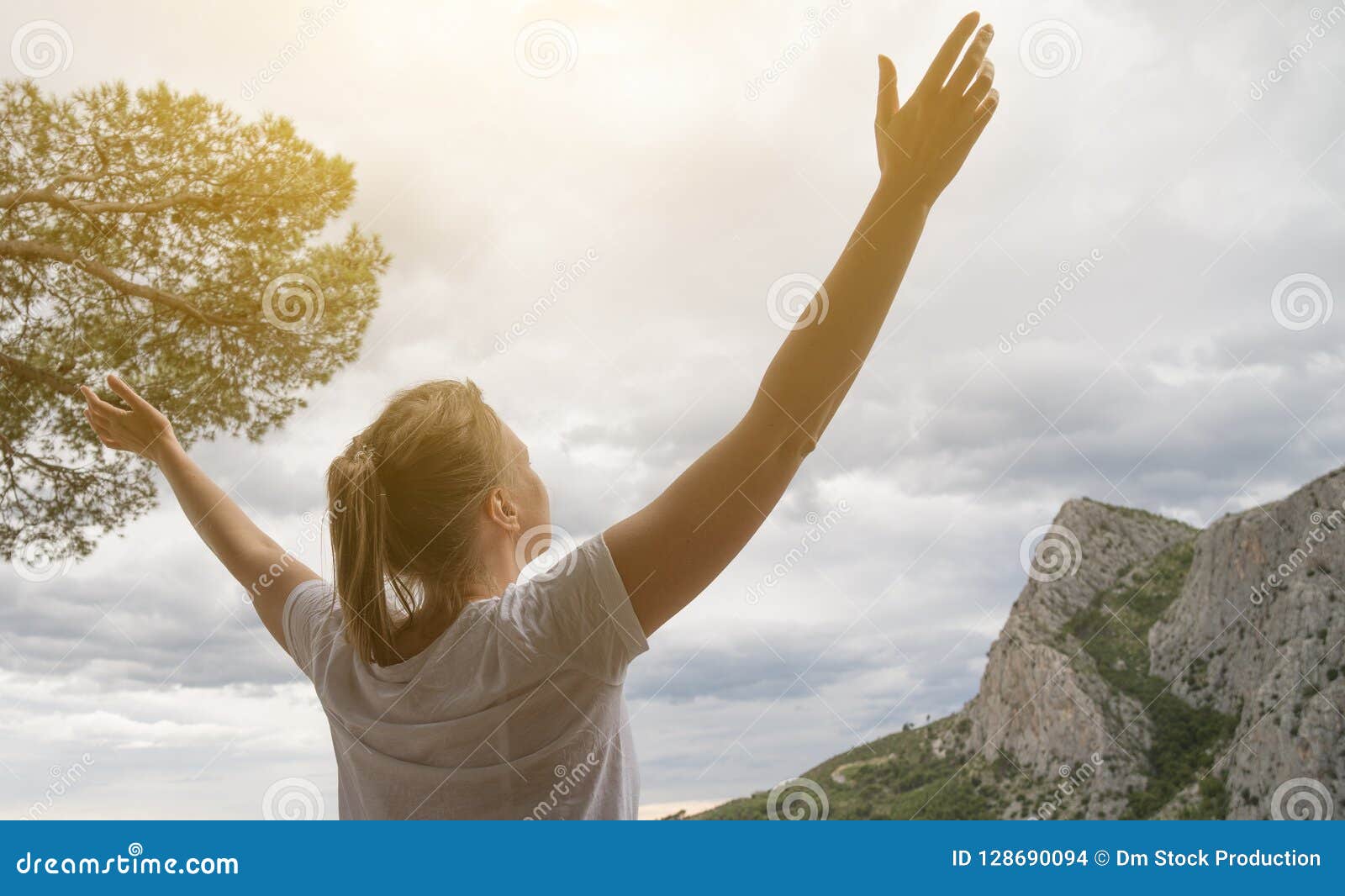 Woman with arms wide open. stock photo. Image of hiker - 128690094