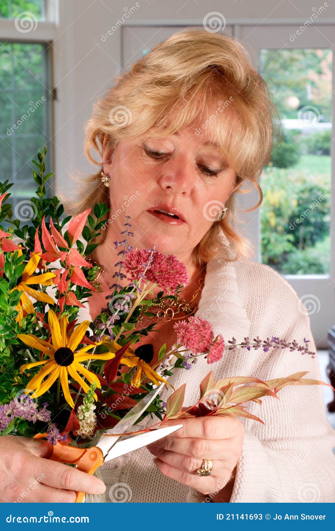Woman Arranging Fall Flowers Stock Image - Image of orange, trim: 21141693