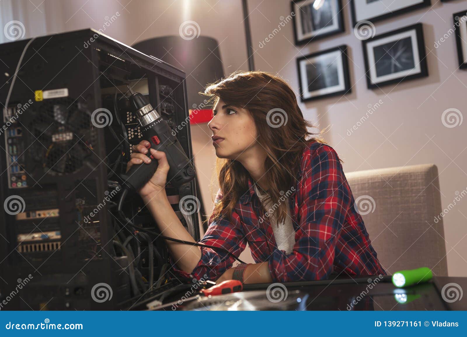 Woman Assembling Computer Components Using Electrical Screwdriver Stock ...