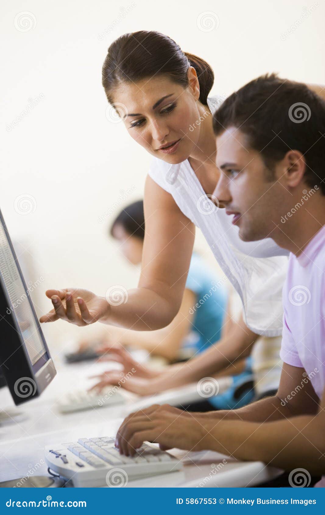 Woman Assisting Man in Computer Room Stock Image - Image of people ...