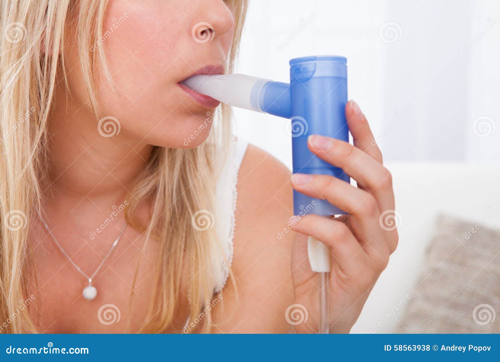 Woman with asthma inhaler stock photo. Image of breath - 58563938